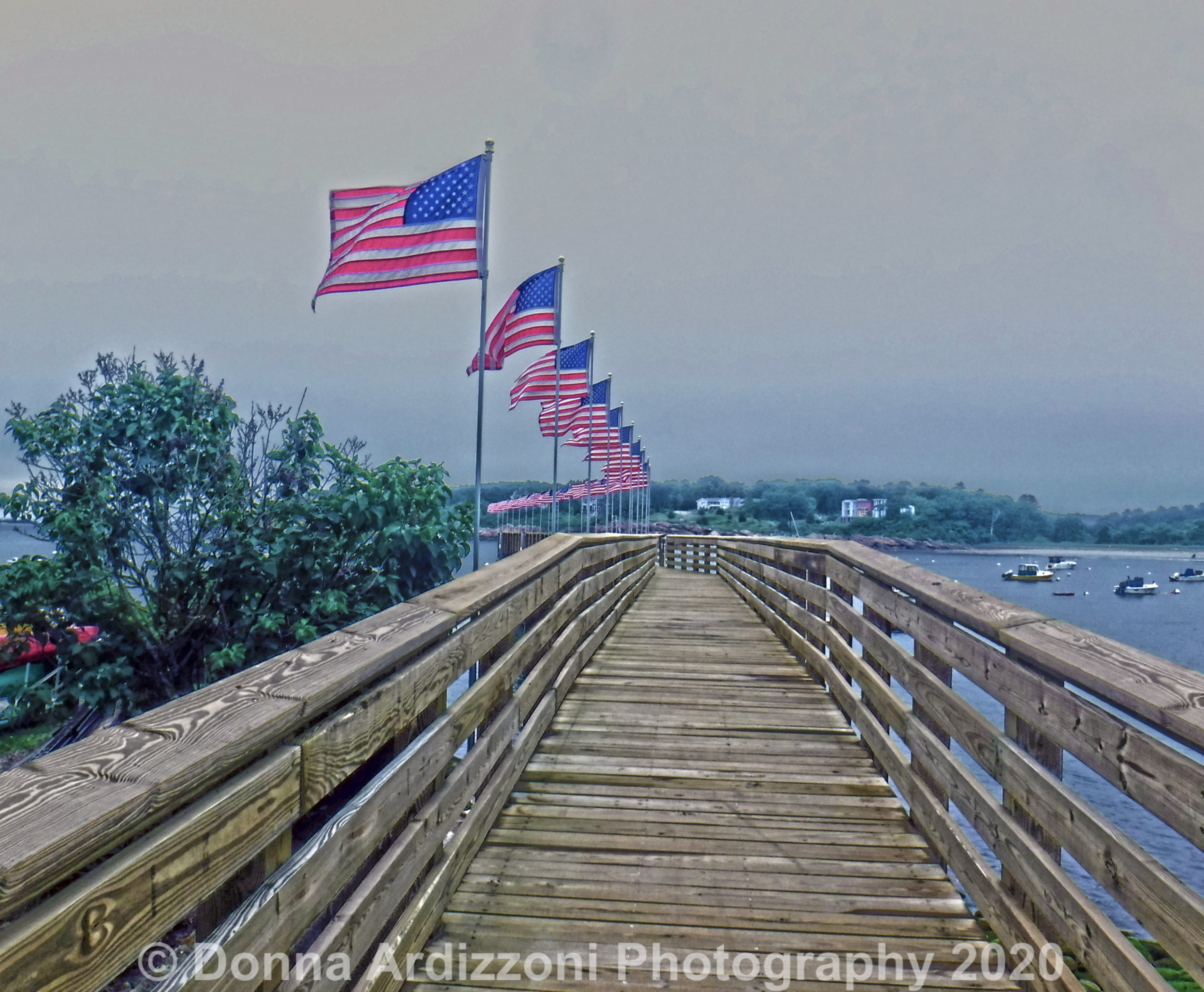 Fog, Rain and the flags on the new Magnolia Pier – Good Morning Gloucester