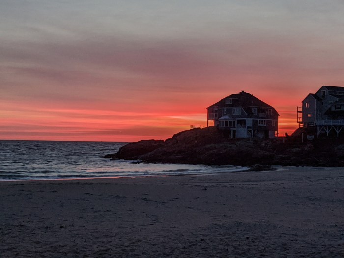 December morning, Long Beach. Sunrise reflections on cottage doors and ...