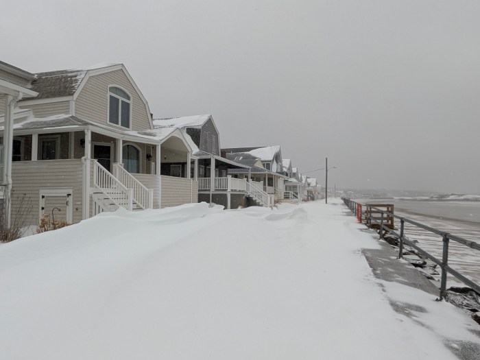 Snowstorm videos photos: Wind swirls heavy snow drifts taller than a ...